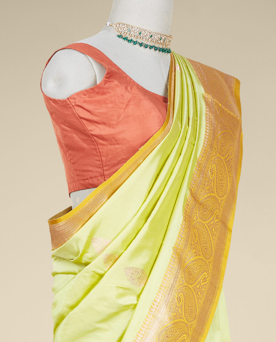 Green banaras kathan silk saree with unique buttas, contrast tradition