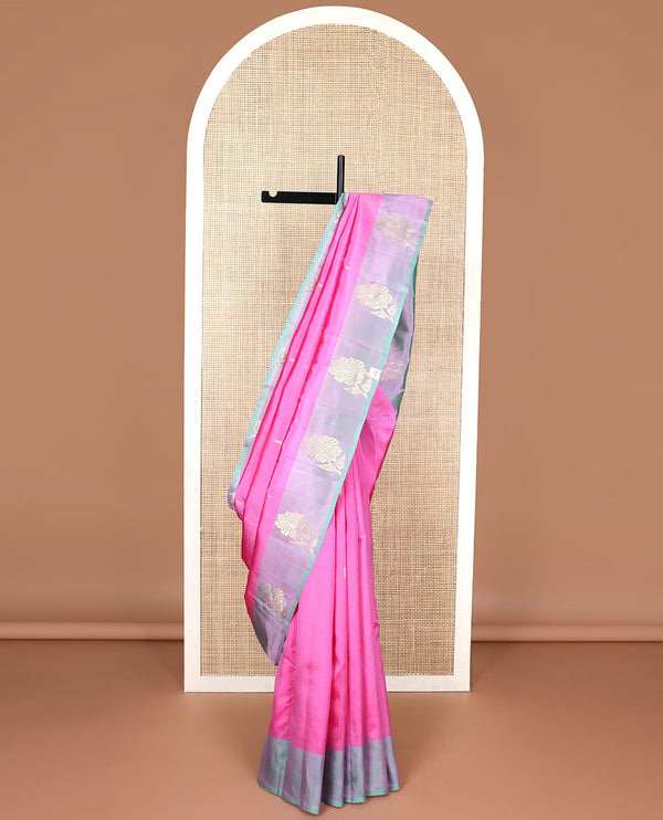 Pink kancheepuram silk saree with contrast floral design border & flor