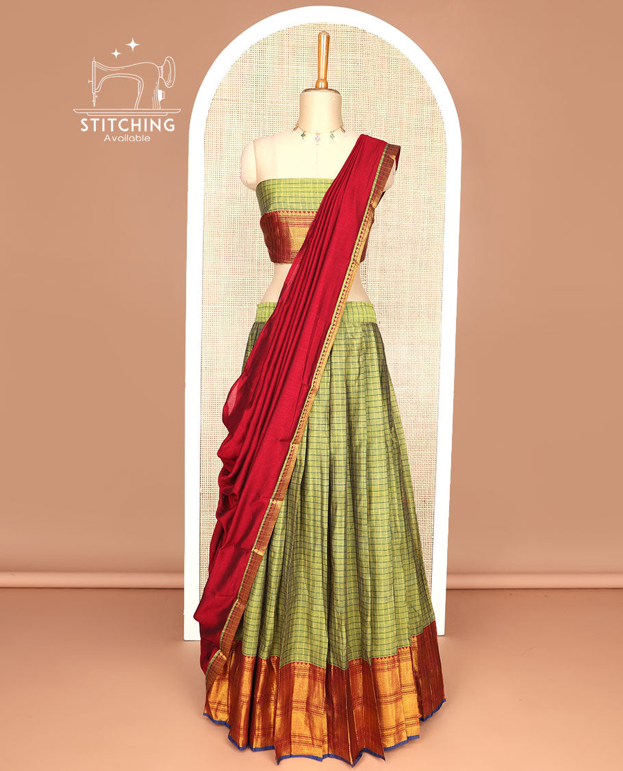 Green checked cotton half saree with contrast intricate zari design bo